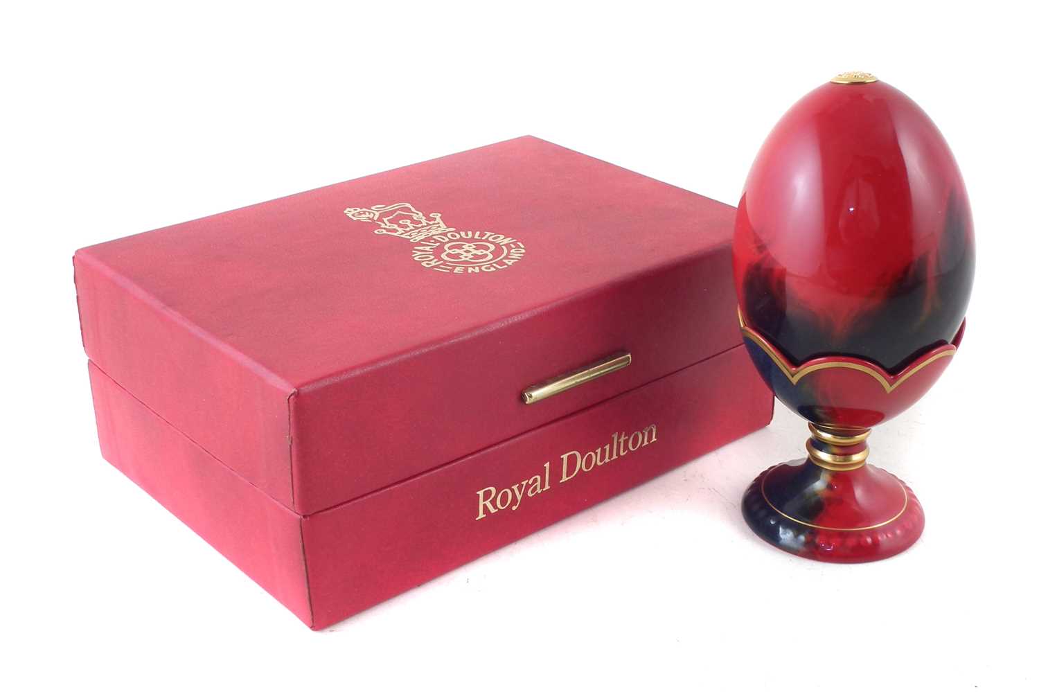 Lot 121 - Royal Doulton flambe egg and stand,