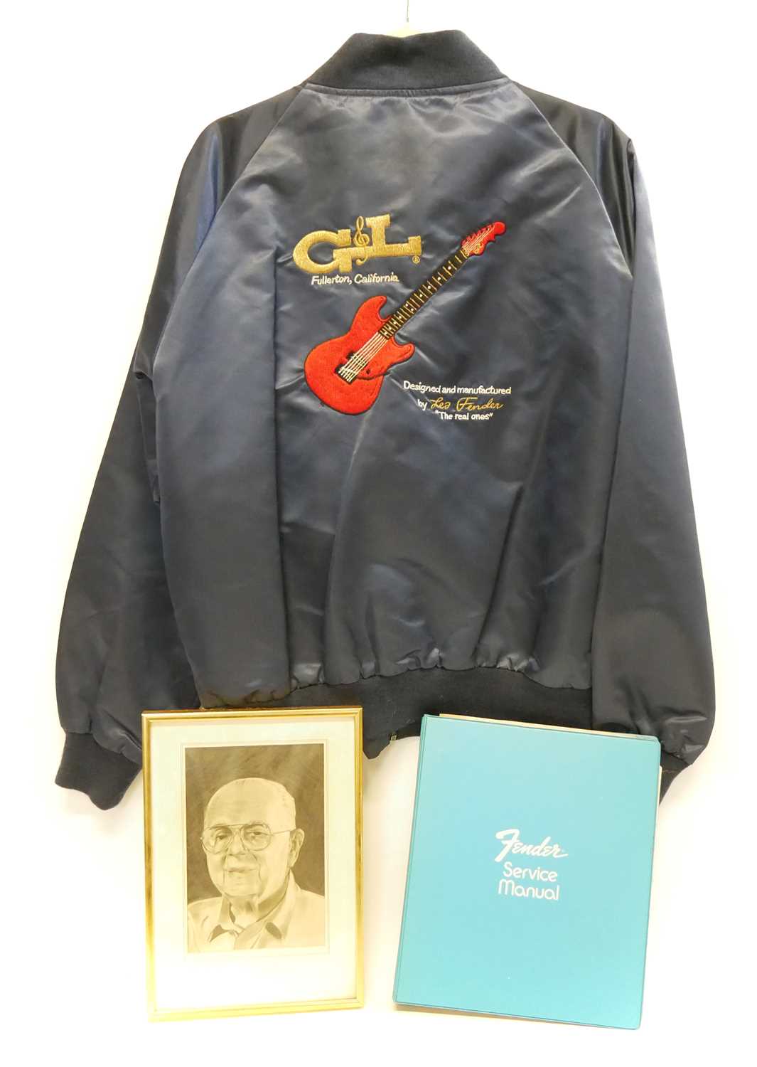 Lot 223 - G&L Fender jacket, Fender Service manual and